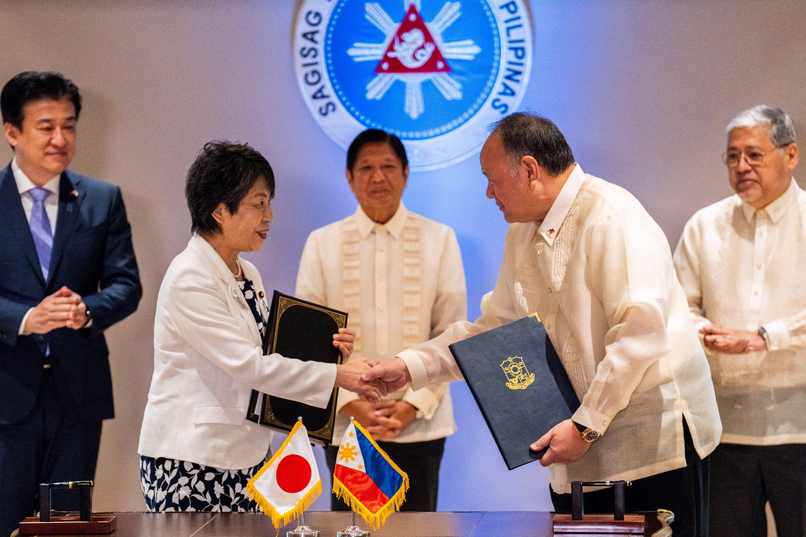 Philippines, Japan Sign Defense Pact Amid South China Sea Tensions ...